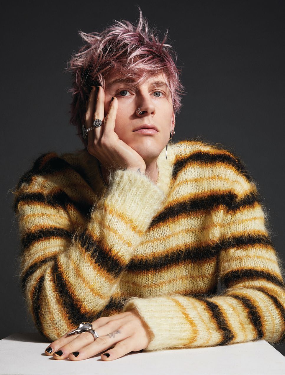 Taurus Star MGK Shines: Critics Rave About Colson Baker